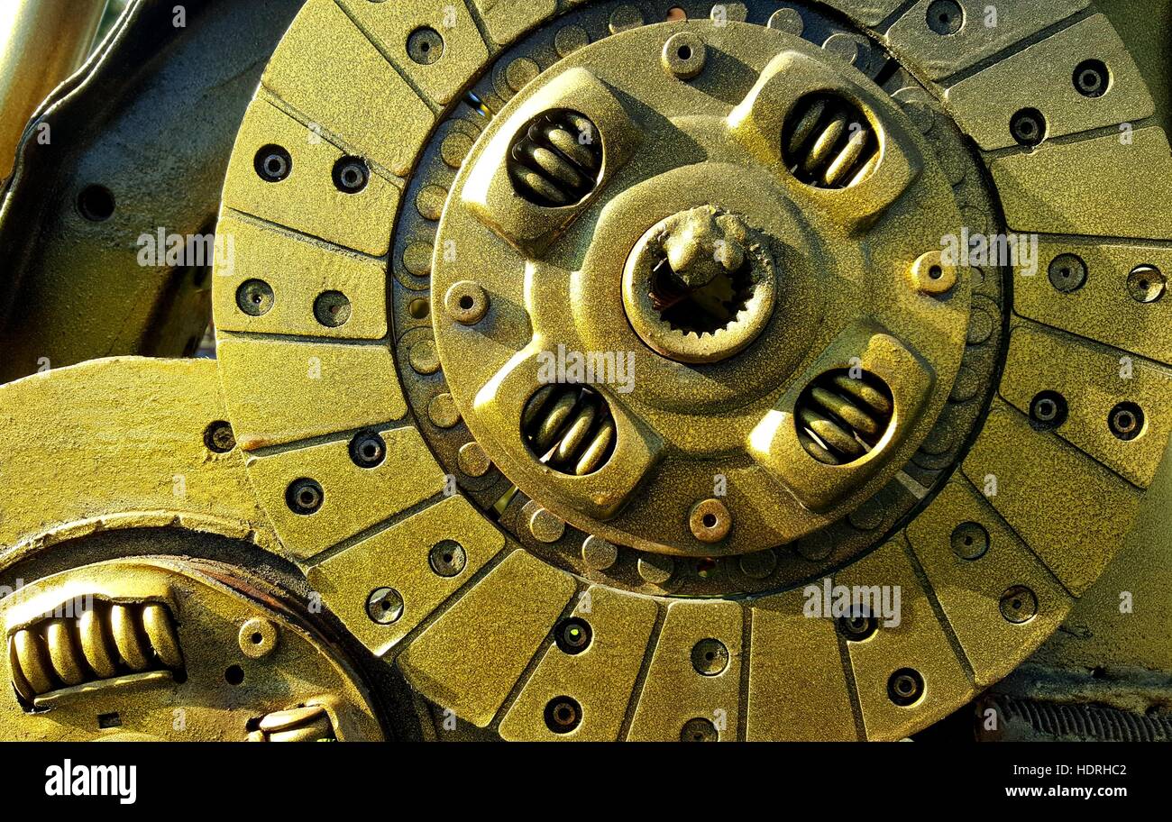 Yellow painted automobile engine part Stock Photo - Alamy