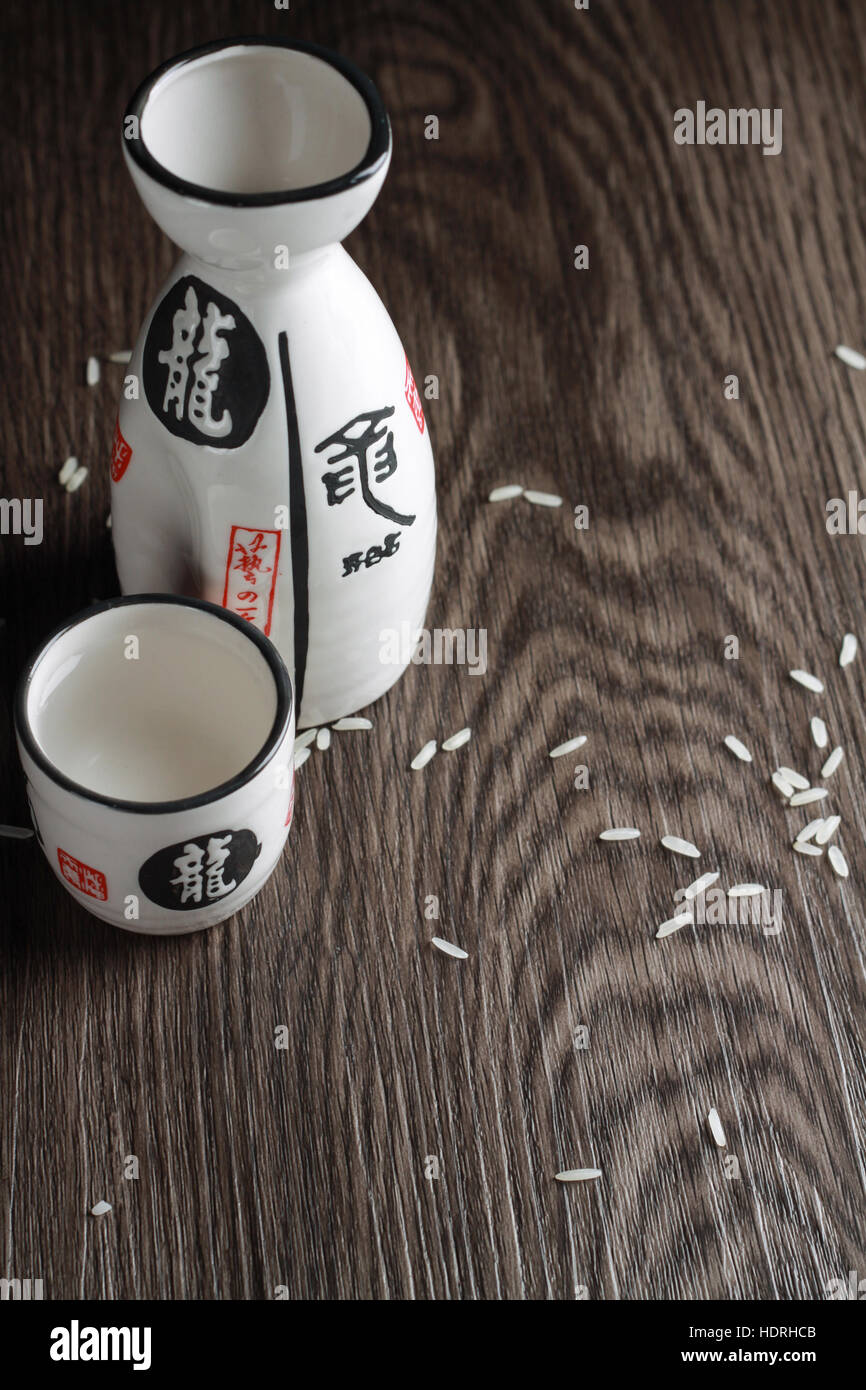 japan sake ceramic botle and cup with black background Stock Photo - Alamy