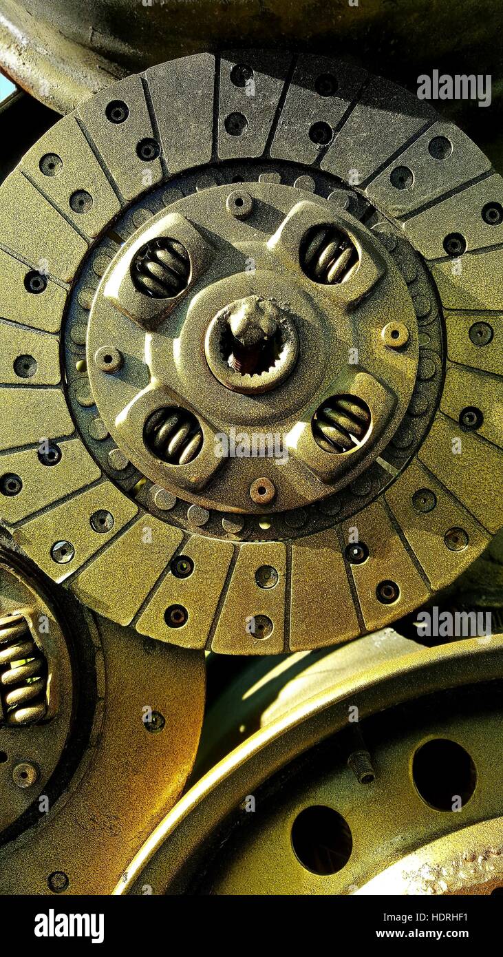Yellow painted automobile engine part Stock Photo - Alamy