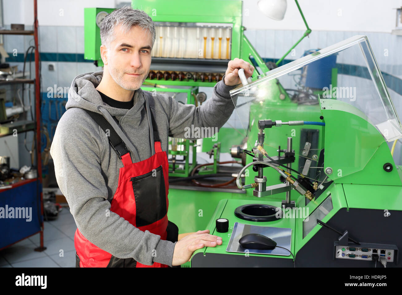 Car mechanic in the workshop. Auto mechanic workshop. Car mechanics ...