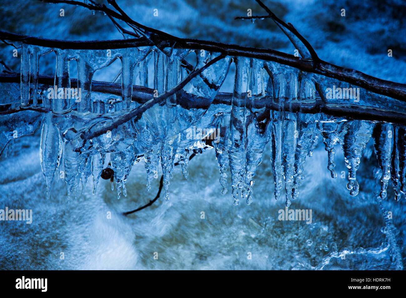 Frozen waterfall with blue ice in winter Stock Photo - Alamy