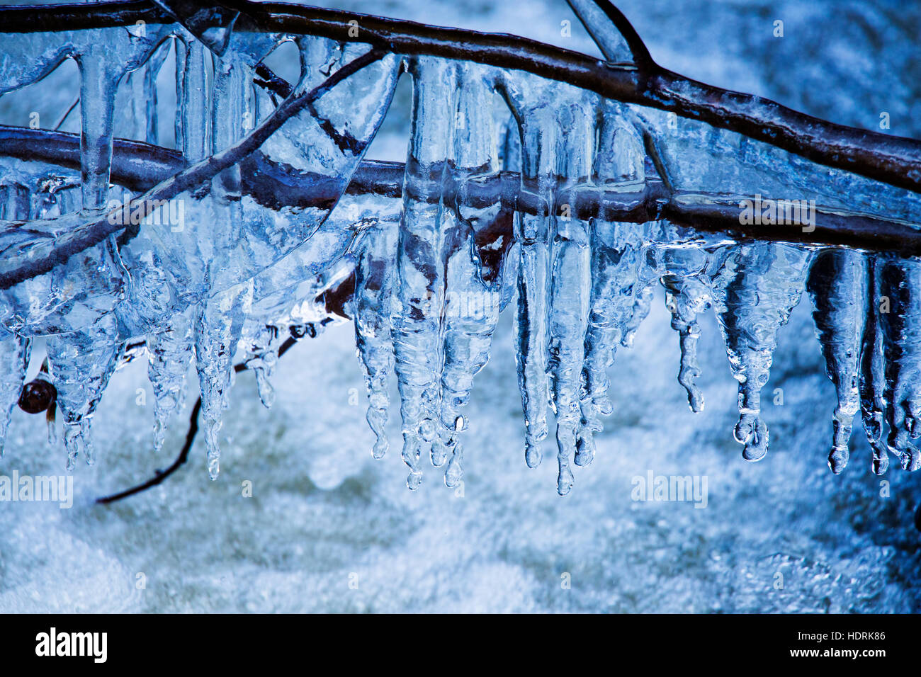 Frozen waterfall with blue ice in winter Stock Photo - Alamy