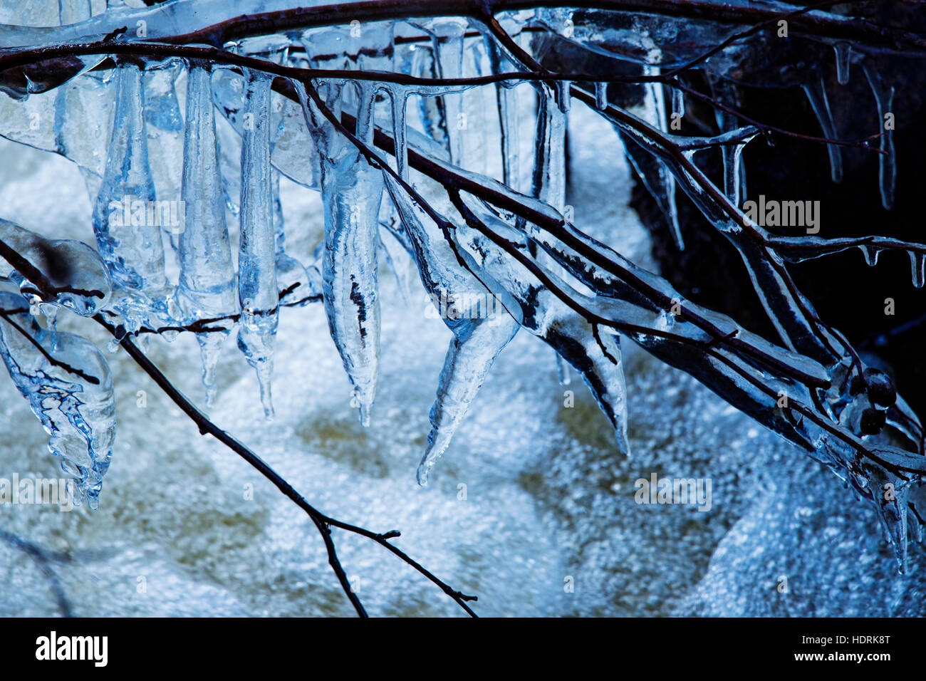 Frozen waterfall with blue ice in winter Stock Photo - Alamy