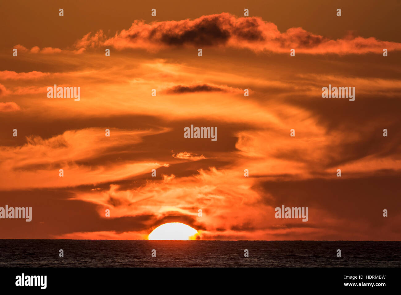 The setting sun observed from the Kona coast; Kona, Island of Hawaii ...