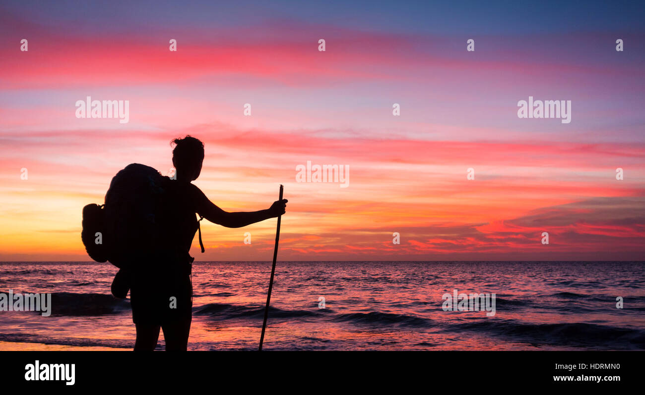 Hiker on remote Guigui (or Guyguy) beach on the west coast of Gran ...