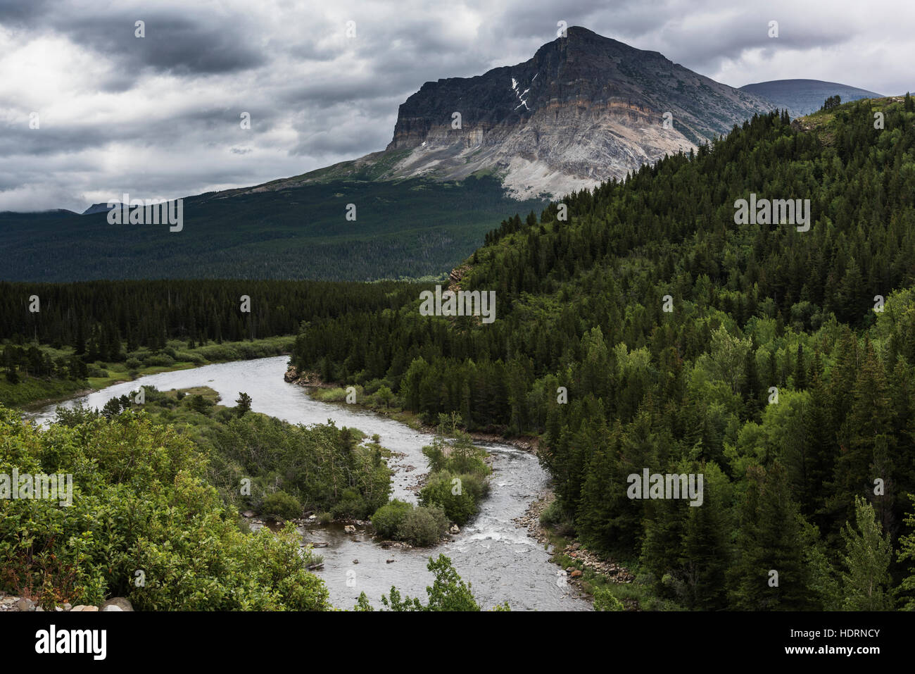 Dense forest, rugged mountain and river flowing through the landscape ...