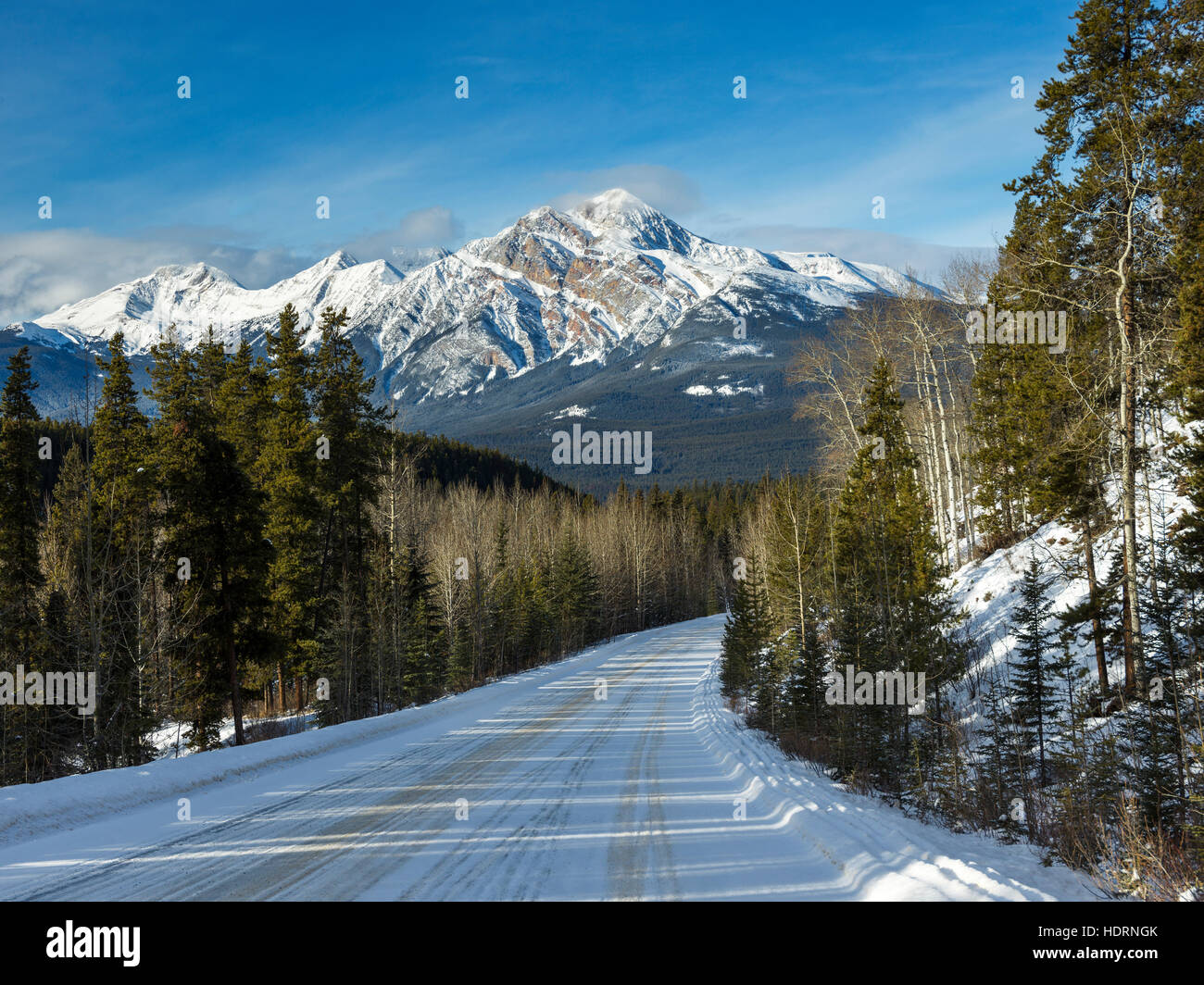 Driving in rocky mountains covered hi-res stock photography and images ...
