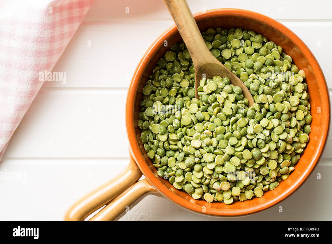 Green split peas in bowl on kitchen table. Top view Stock Photo - Alamy