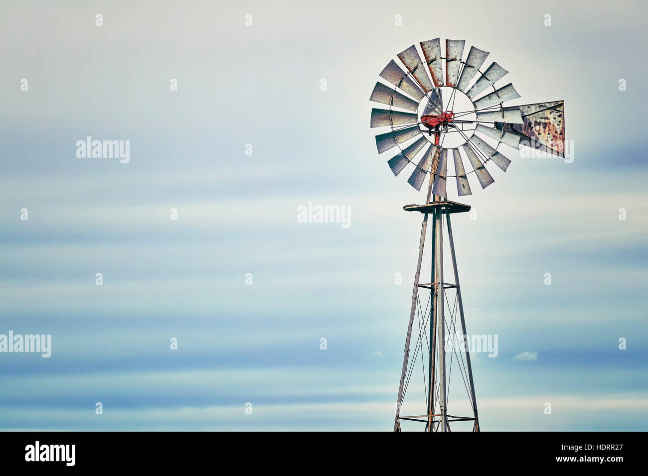 Vintage toned photo of an old western windmill tower, American wild ...