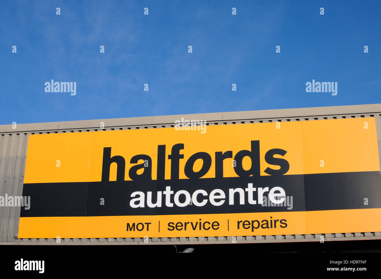 Halfords AutoCentre sign Stock Photo - Alamy