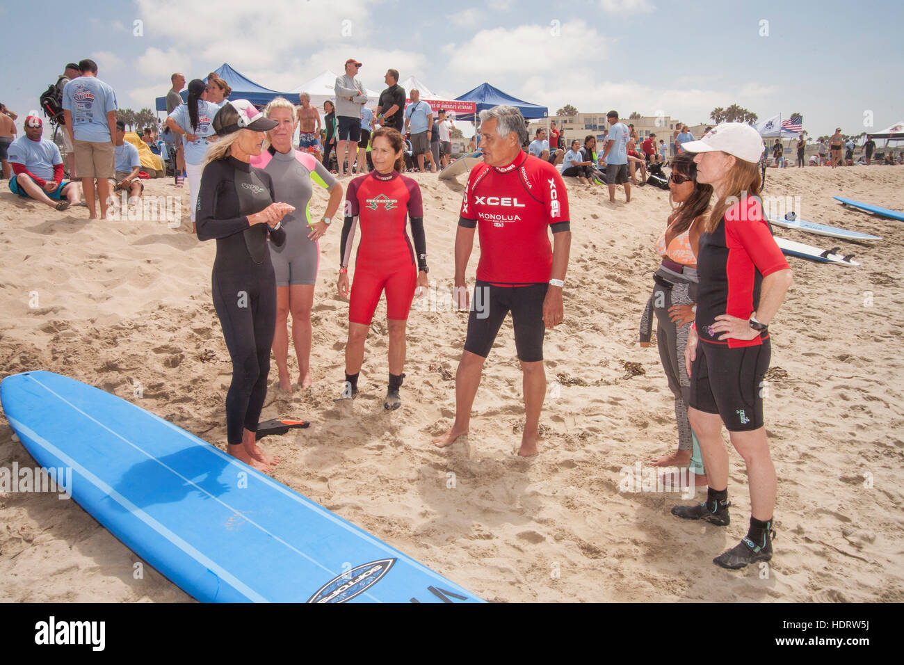 In thanks for his military service, a veteran (center) receives a free ...