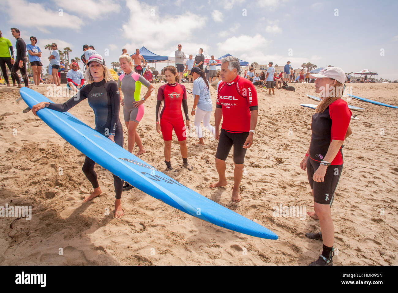 In thanks for his military service, a veteran (center) receives a free ...