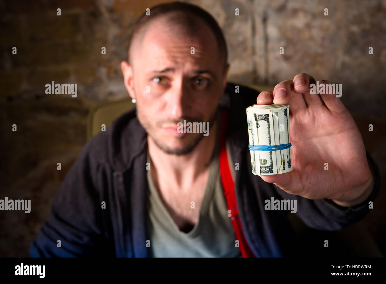 Drug dealer showing money Stock Photo - Alamy
