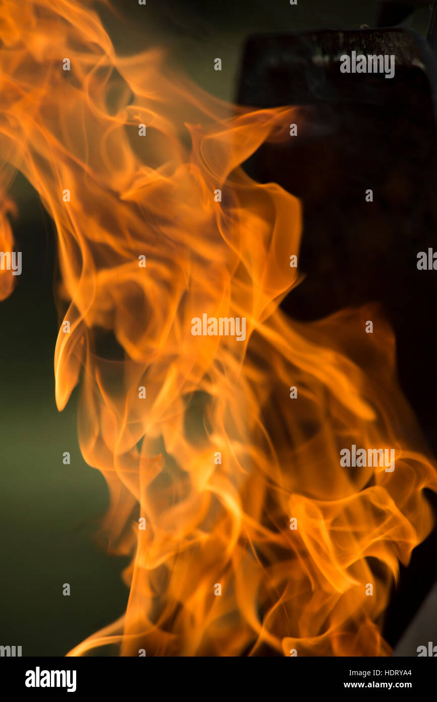 Close-up of flames shooting from grill Stock Photo - Alamy