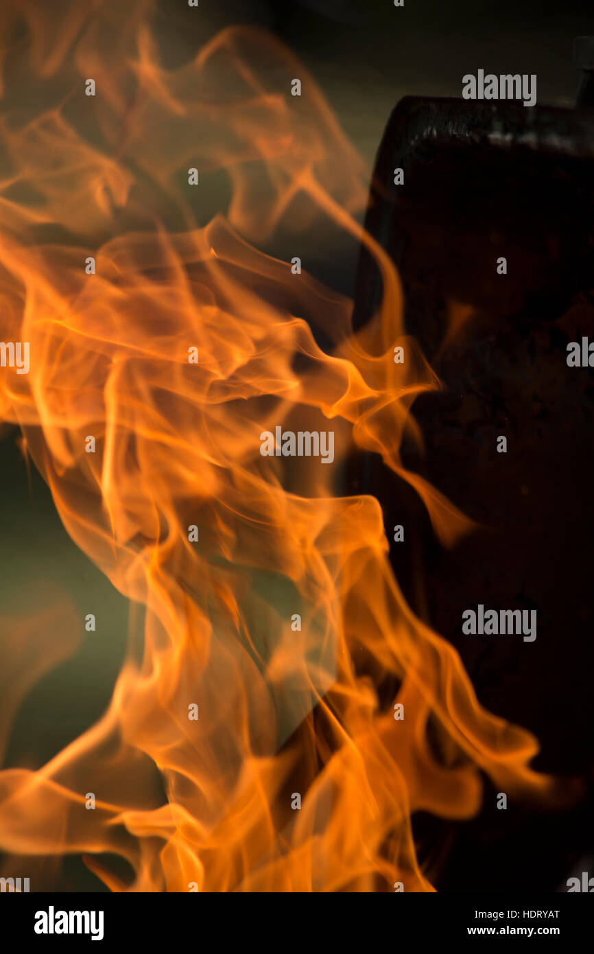 Close-up of flames shooting from grill Stock Photo - Alamy