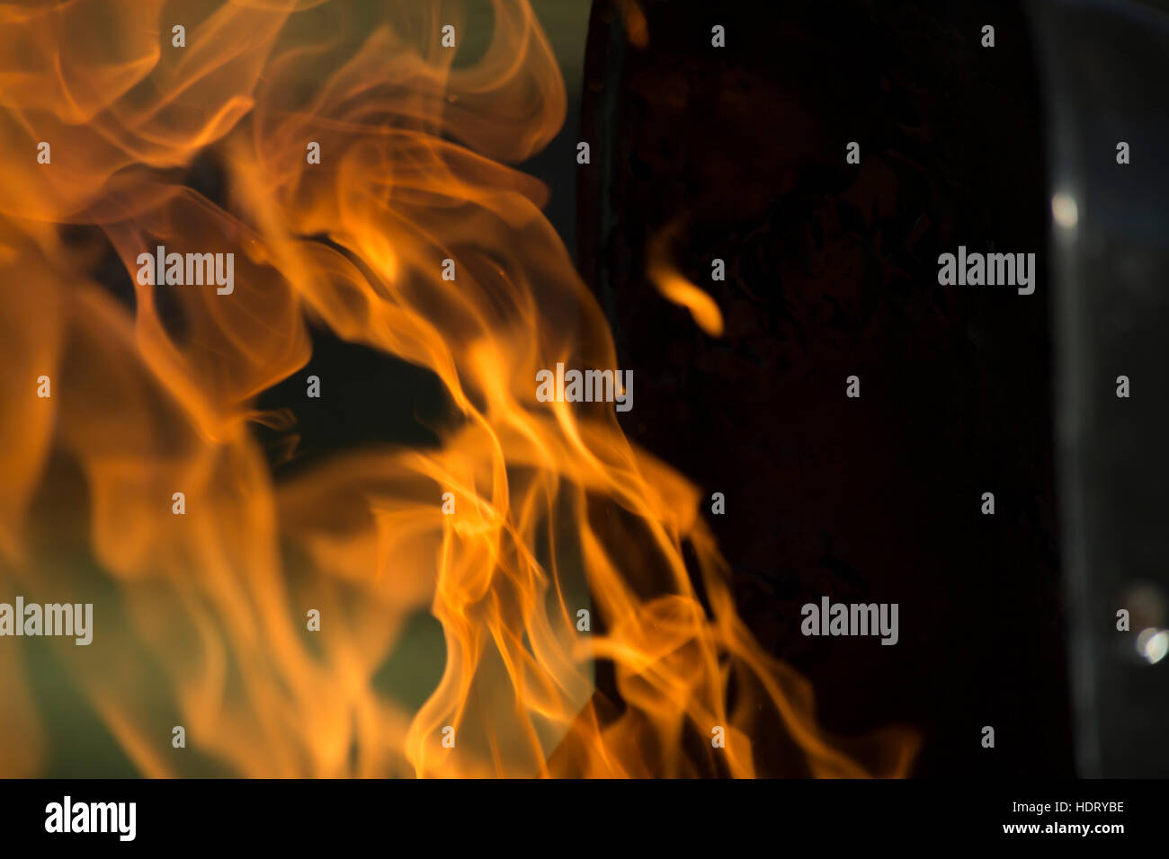 Close-up of flames shooting from grill Stock Photo - Alamy