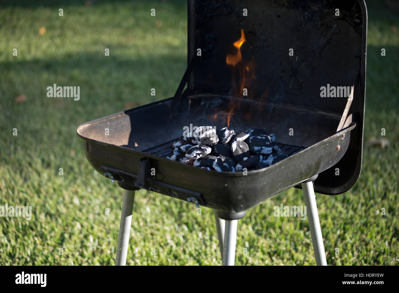 Smoking charcoal with small flame Stock Photo - Alamy