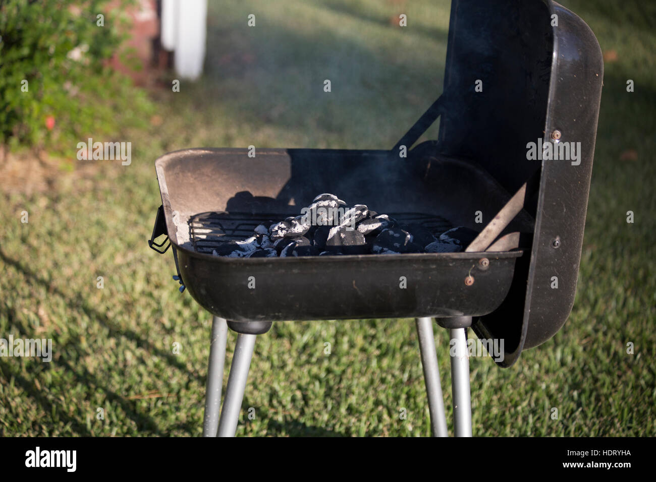 Smoking charcoal with small flame Stock Photo - Alamy