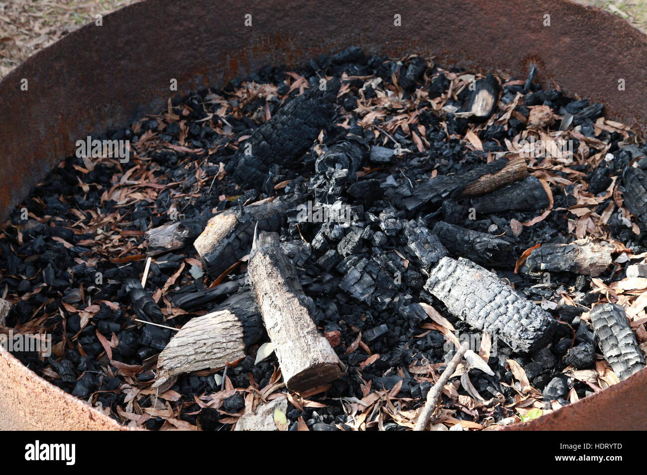 Remnants of burnt firewood at a campsite Stock Photo - Alamy