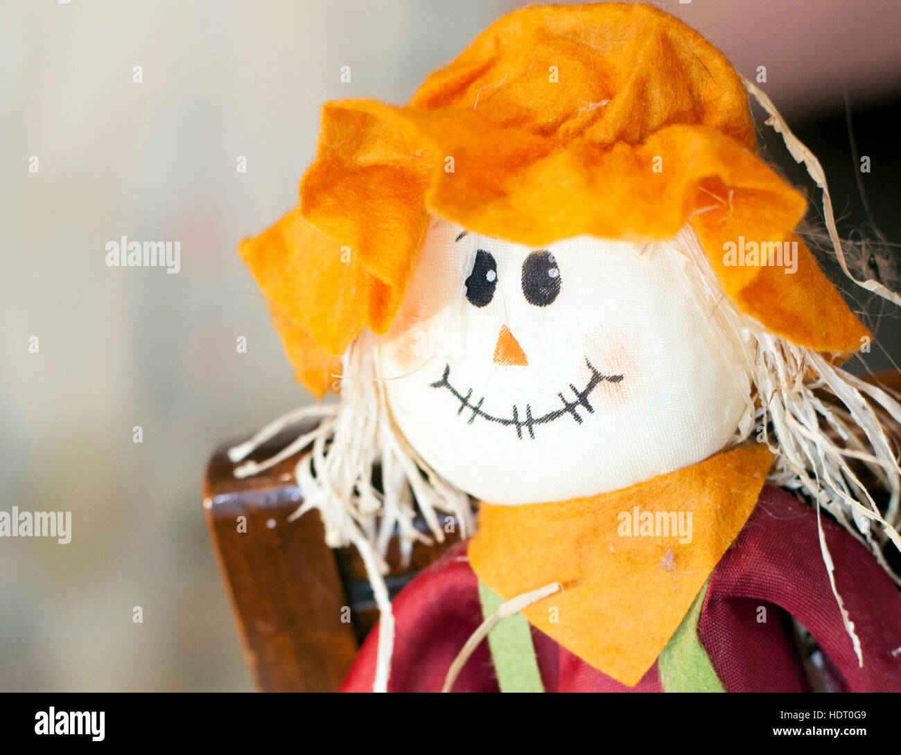 Scarecrow clothed in orange and red Stock Photo - Alamy