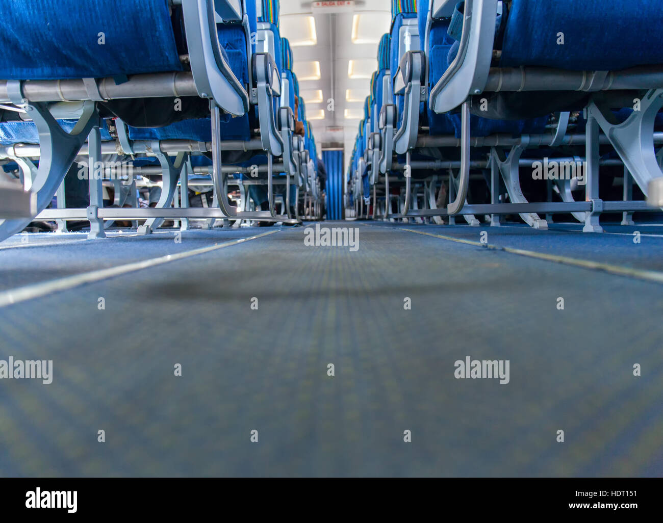 Airplane interior, passenger seat and aisle Stock Photo - Alamy