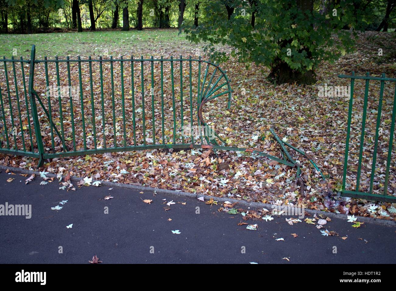 broken fence iron park tailings autumn path Stock Photo - Alamy