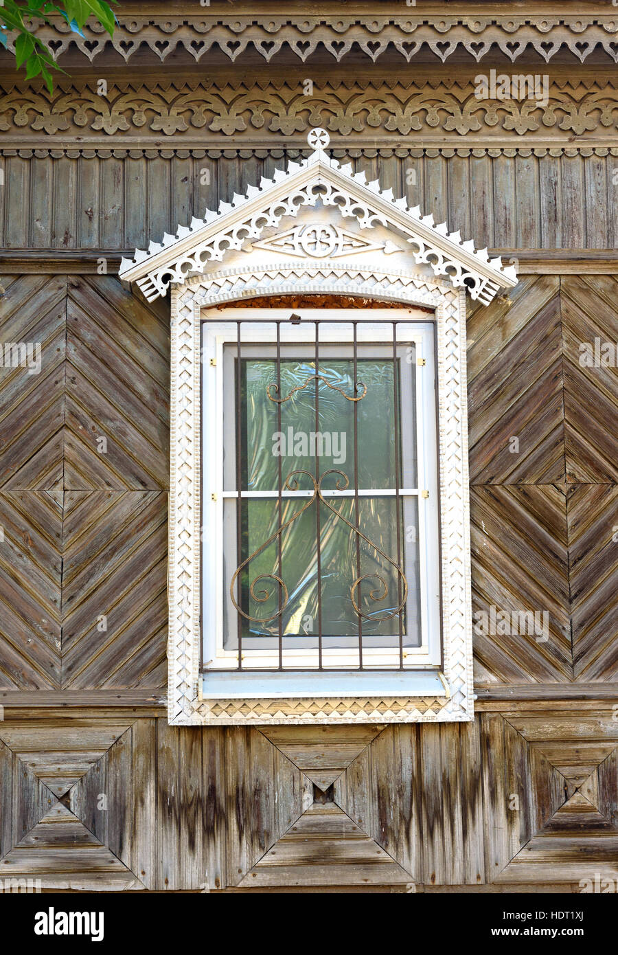 Window with carved patterns on old wooden house Stock Photo - Alamy