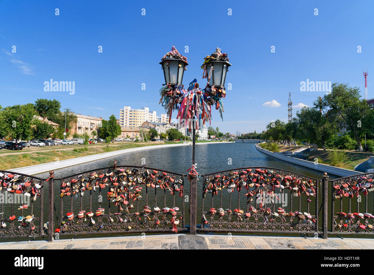Love Bridge with a lot of colored ribbons and locks. Symbol of the ...
