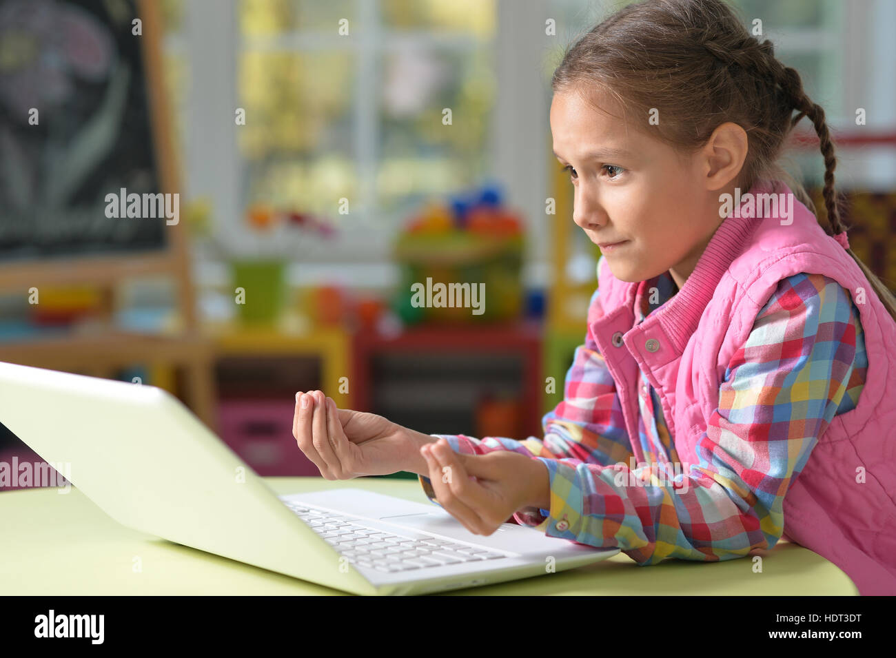 Little girl with laptop Stock Photo - Alamy