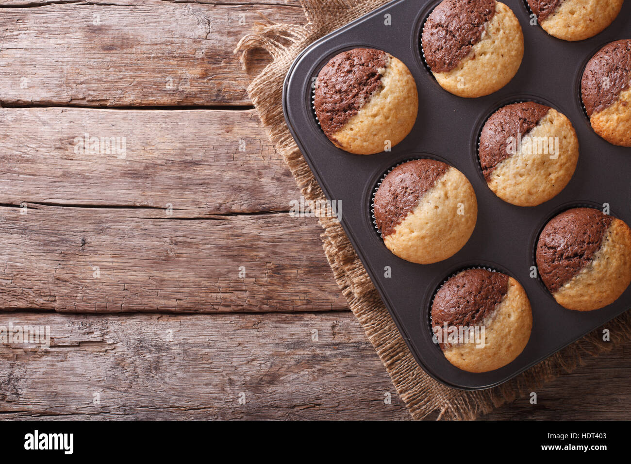 hot colorful cupcakes in a baking dish. horizontal view from above ...