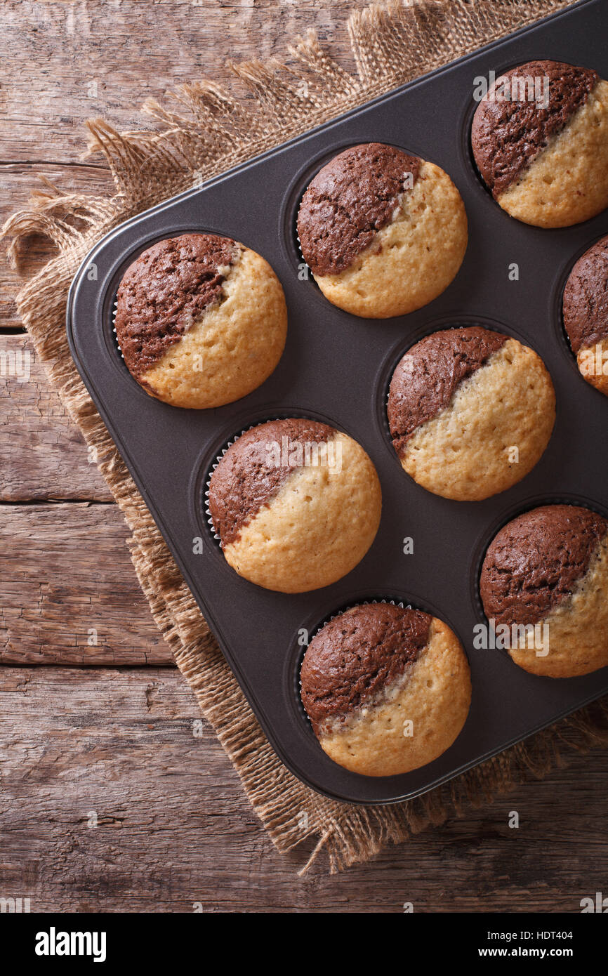 hot colorful cupcakes in a baking dish. Vertical view from above Stock ...