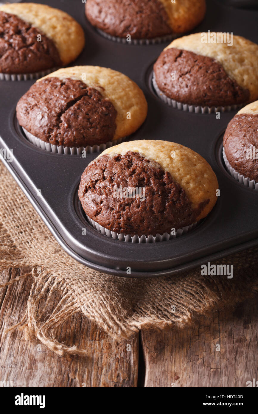 colorful muffins in baking dish from the oven closeup. vertical Stock ...