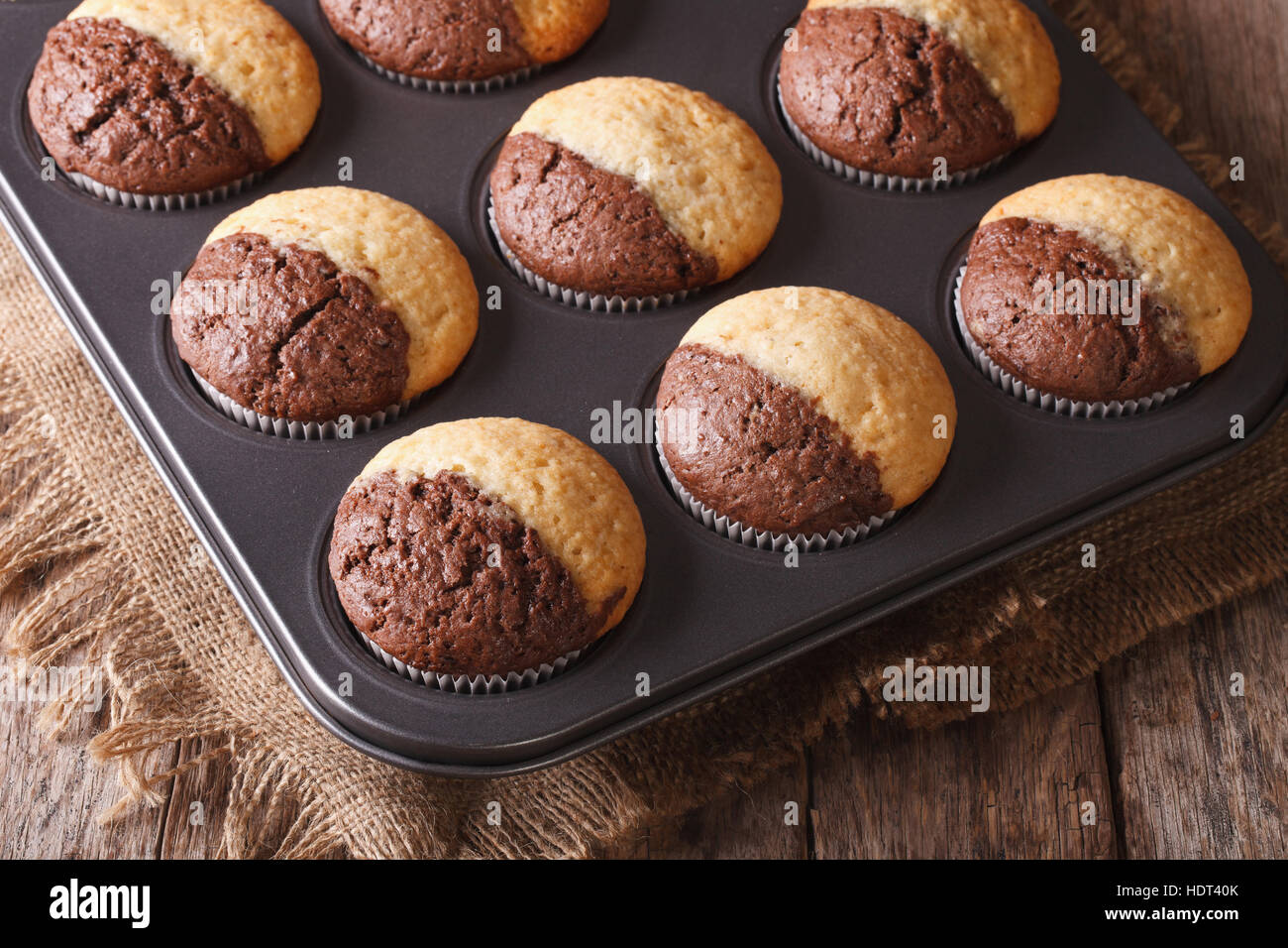 two-color muffins in baking dish from the oven closeup. horizontal ...