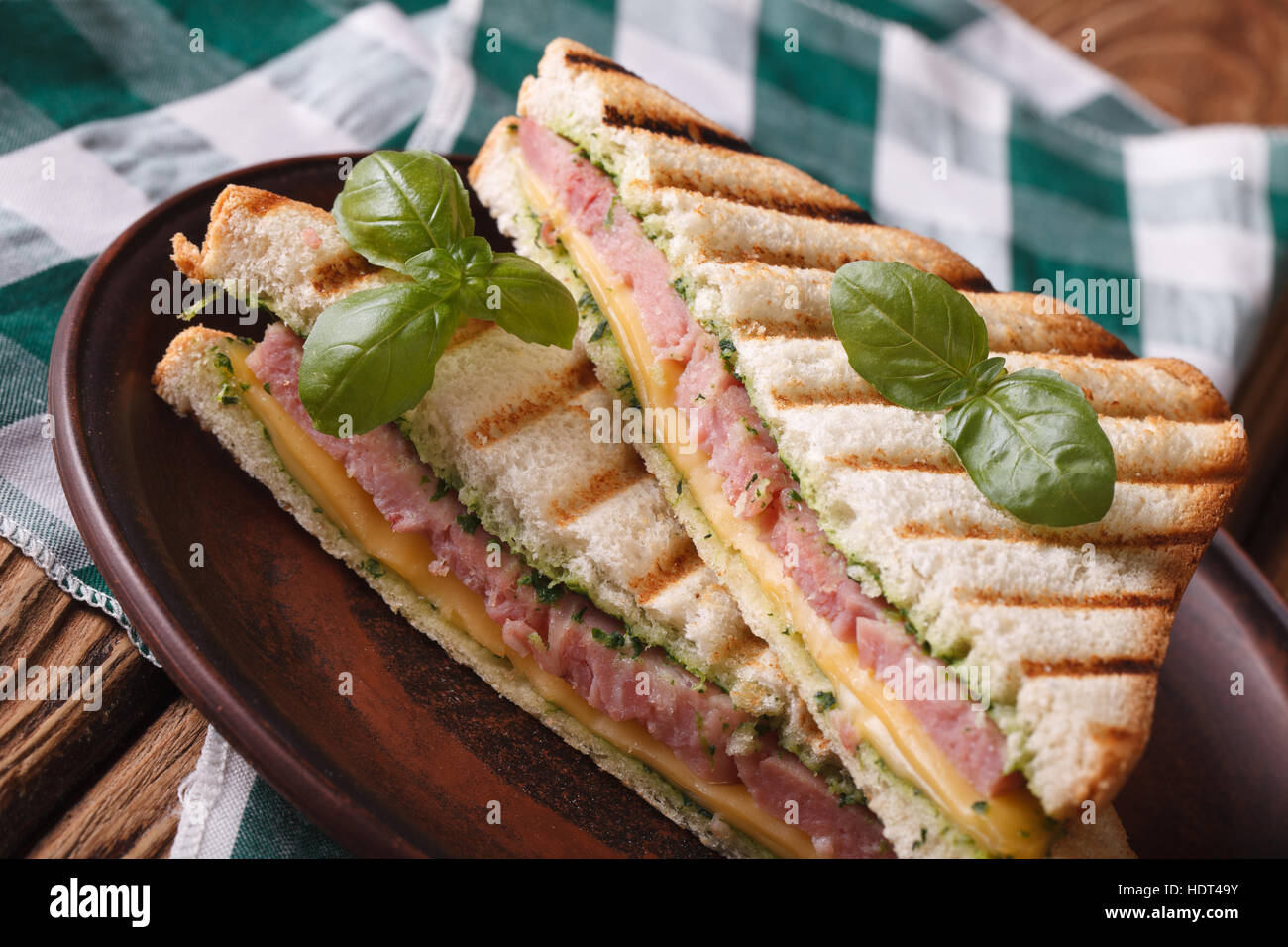 Grilled triangular ham sandwich close up on a plate. horizontal Stock ...