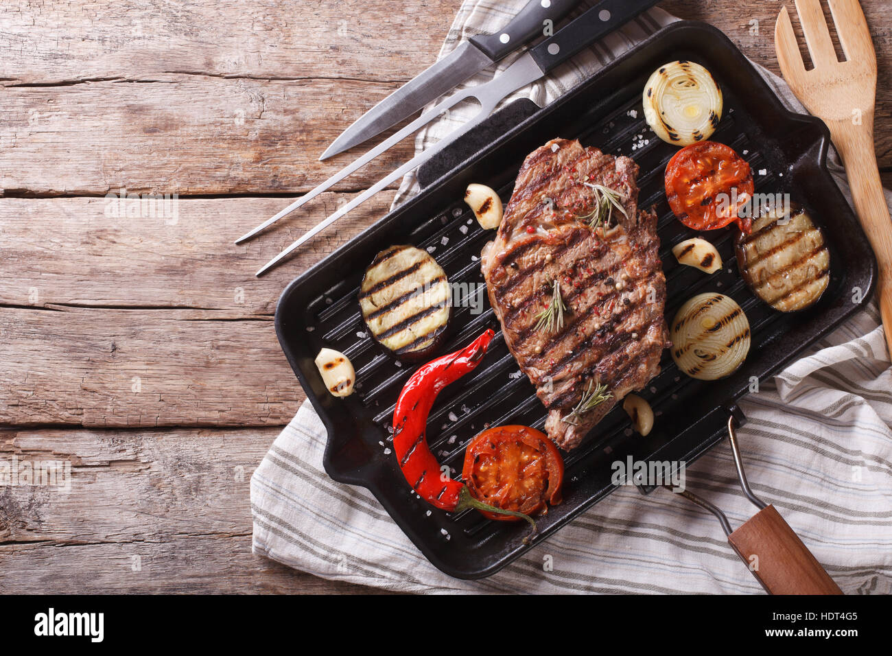 beef steak grilled with onions and eggplant in the pan grill ...
