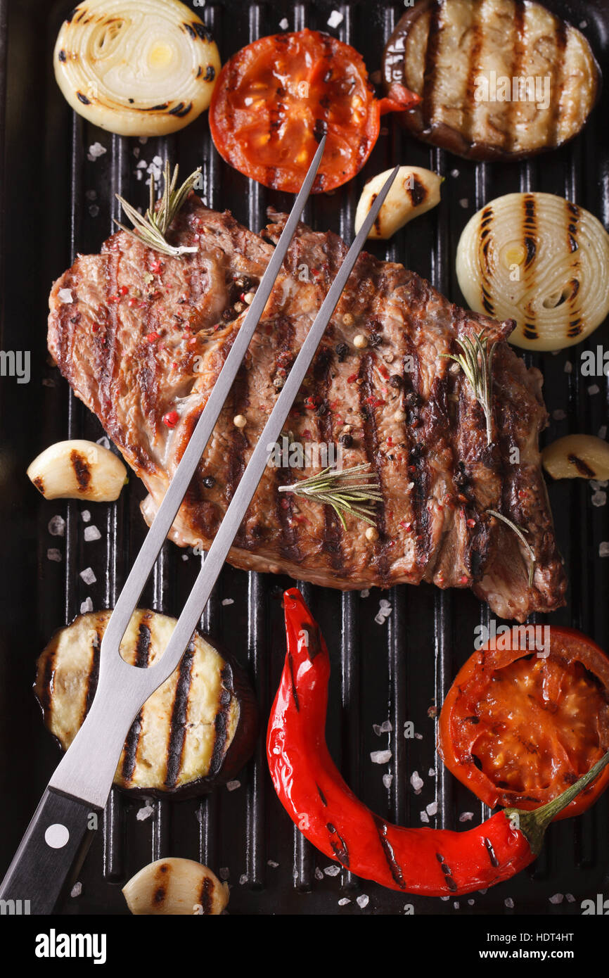 Tasty beef steak and vegetables on the grill close up. background ...