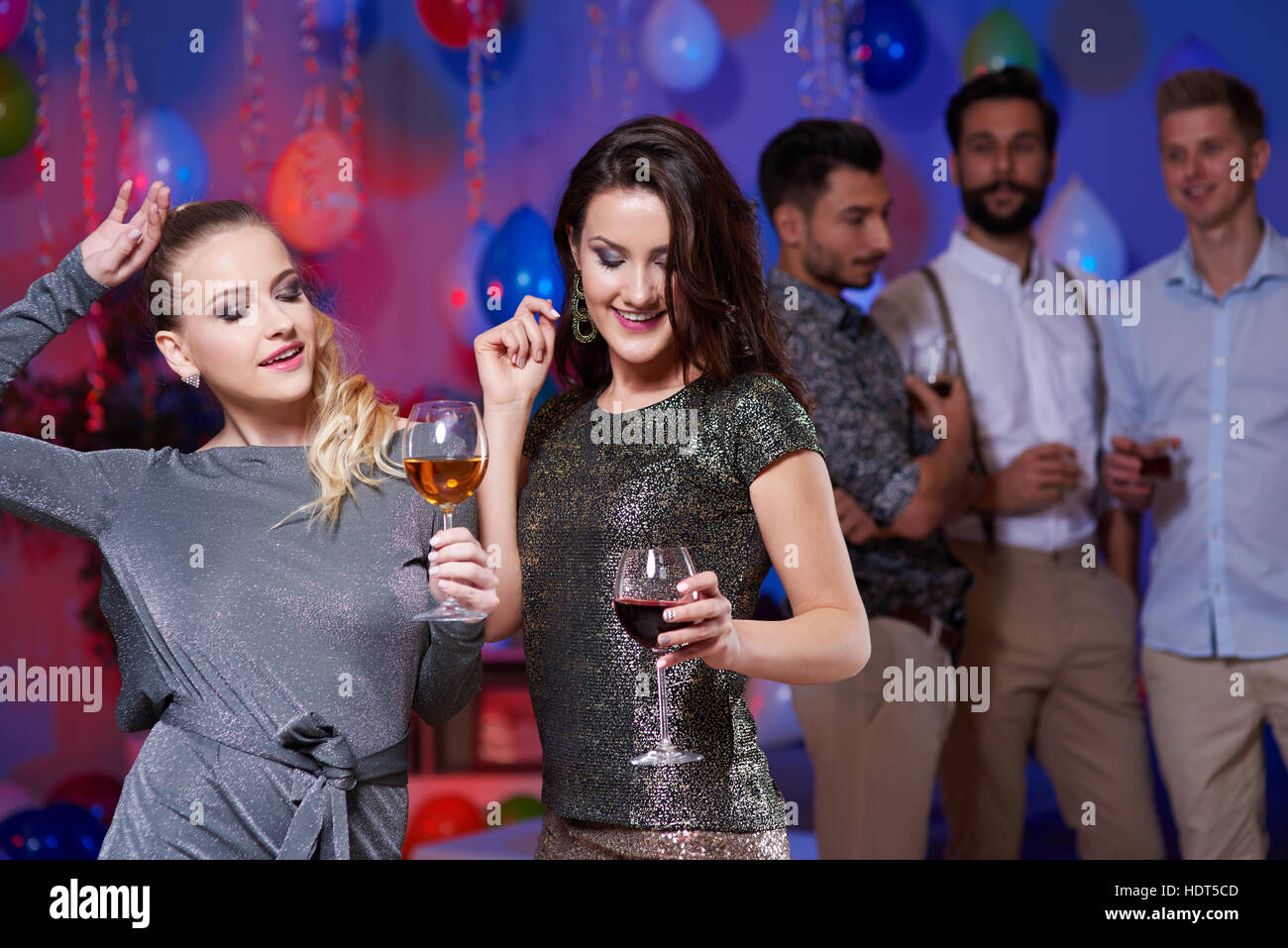 Girls having fun while dancing Stock Photo - Alamy