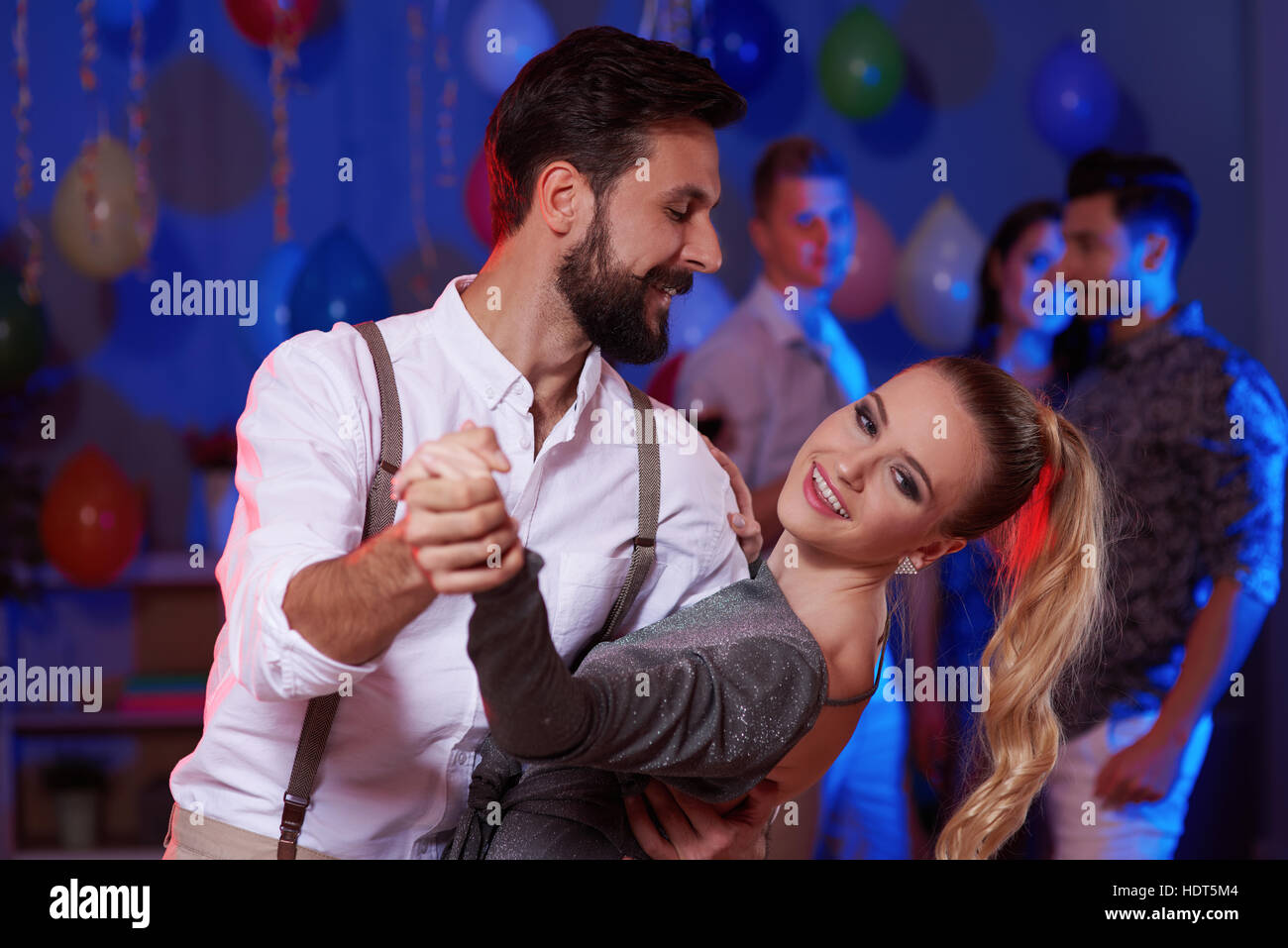 Couple dancing at party hi-res stock photography and images - Alamy