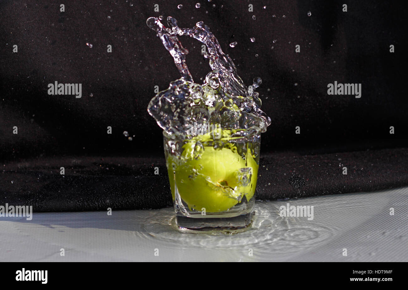 Jujube fruits water splash Stock Photo - Alamy