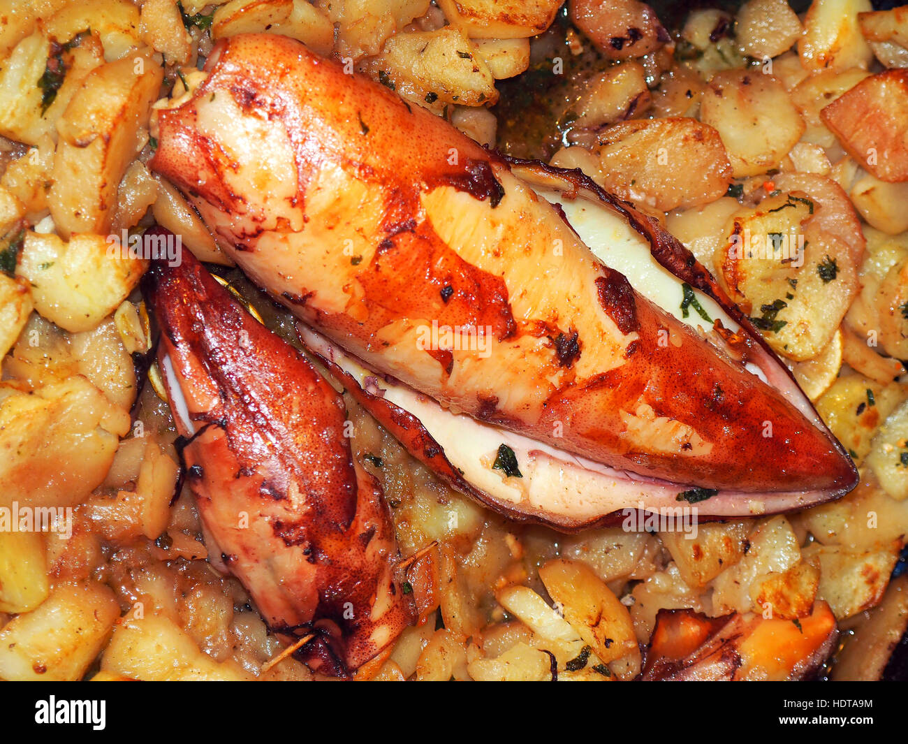 Fried squid stuffed with ham cheese and tentacles Stock Photo - Alamy