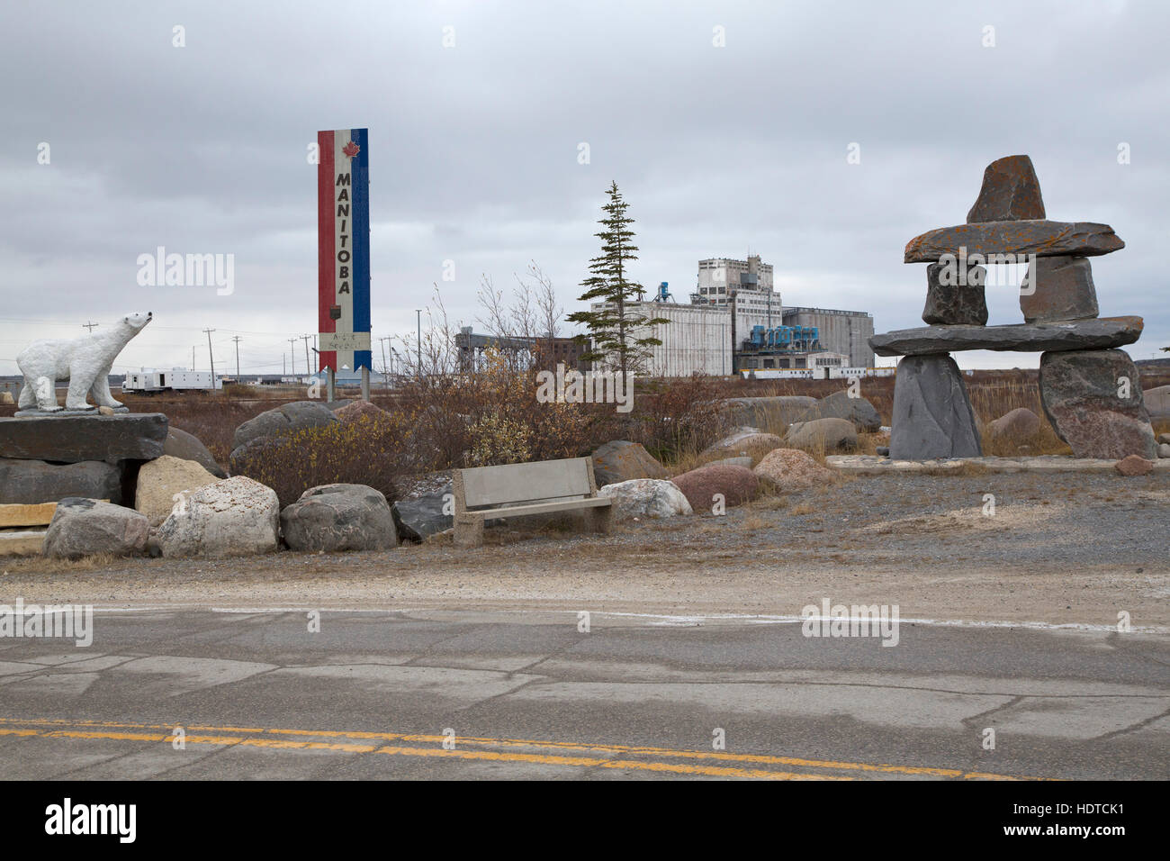 A polar bear statue and Inukshuk near the Port of Churchill in ...