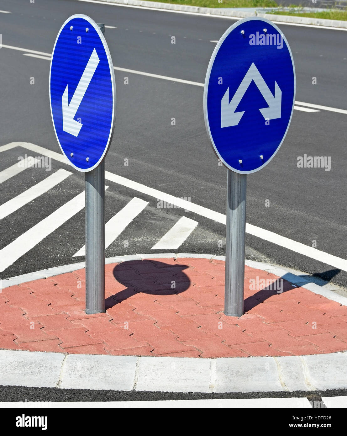 Arrow road signs at the road crossing in the city Stock Photo - Alamy