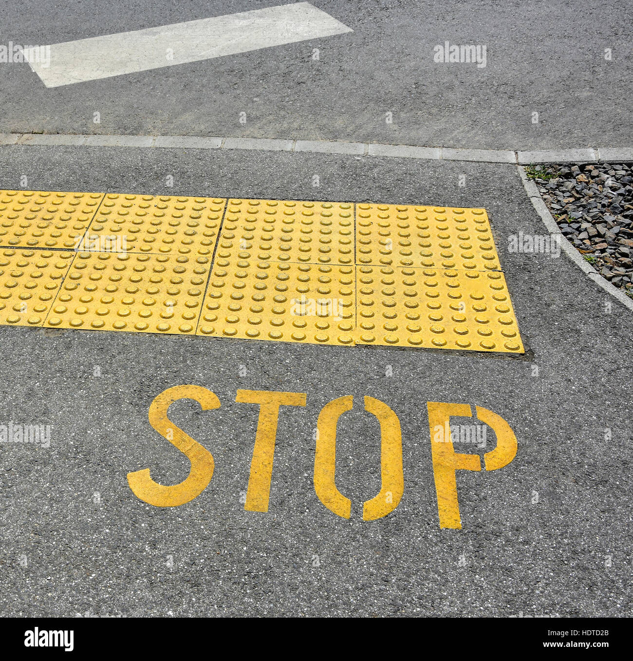 Stop sign on the asphalt at the road crossing Stock Photo - Alamy