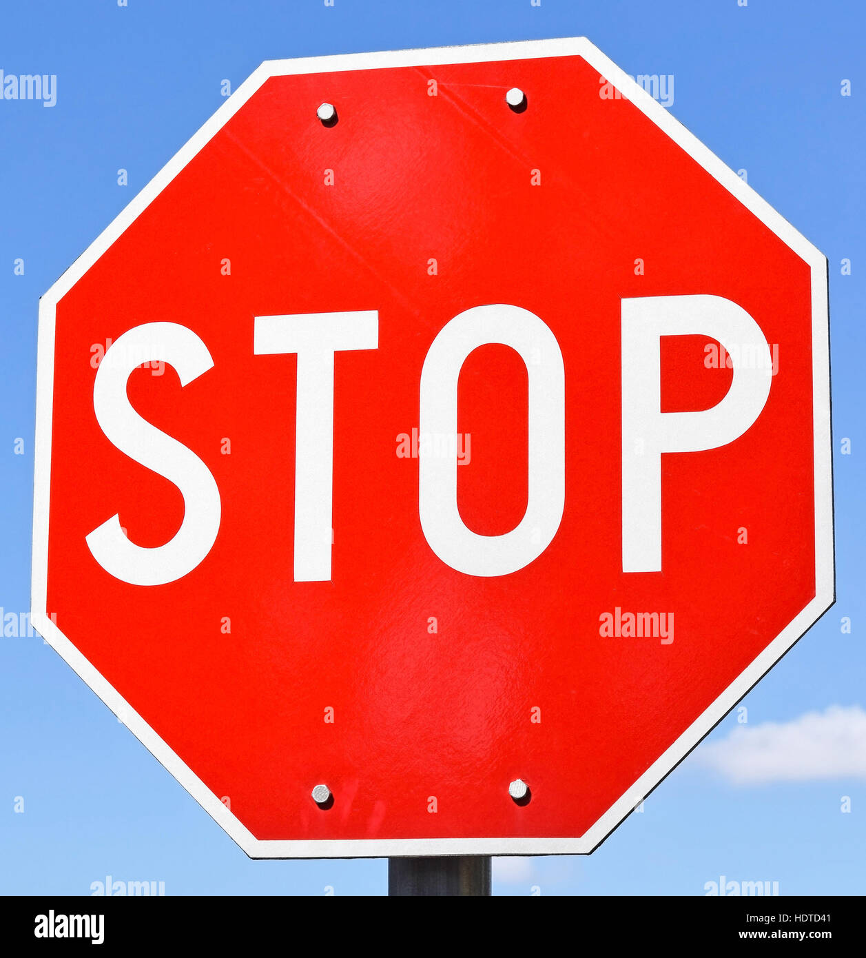 Stop sign at the road crossing Stock Photo - Alamy