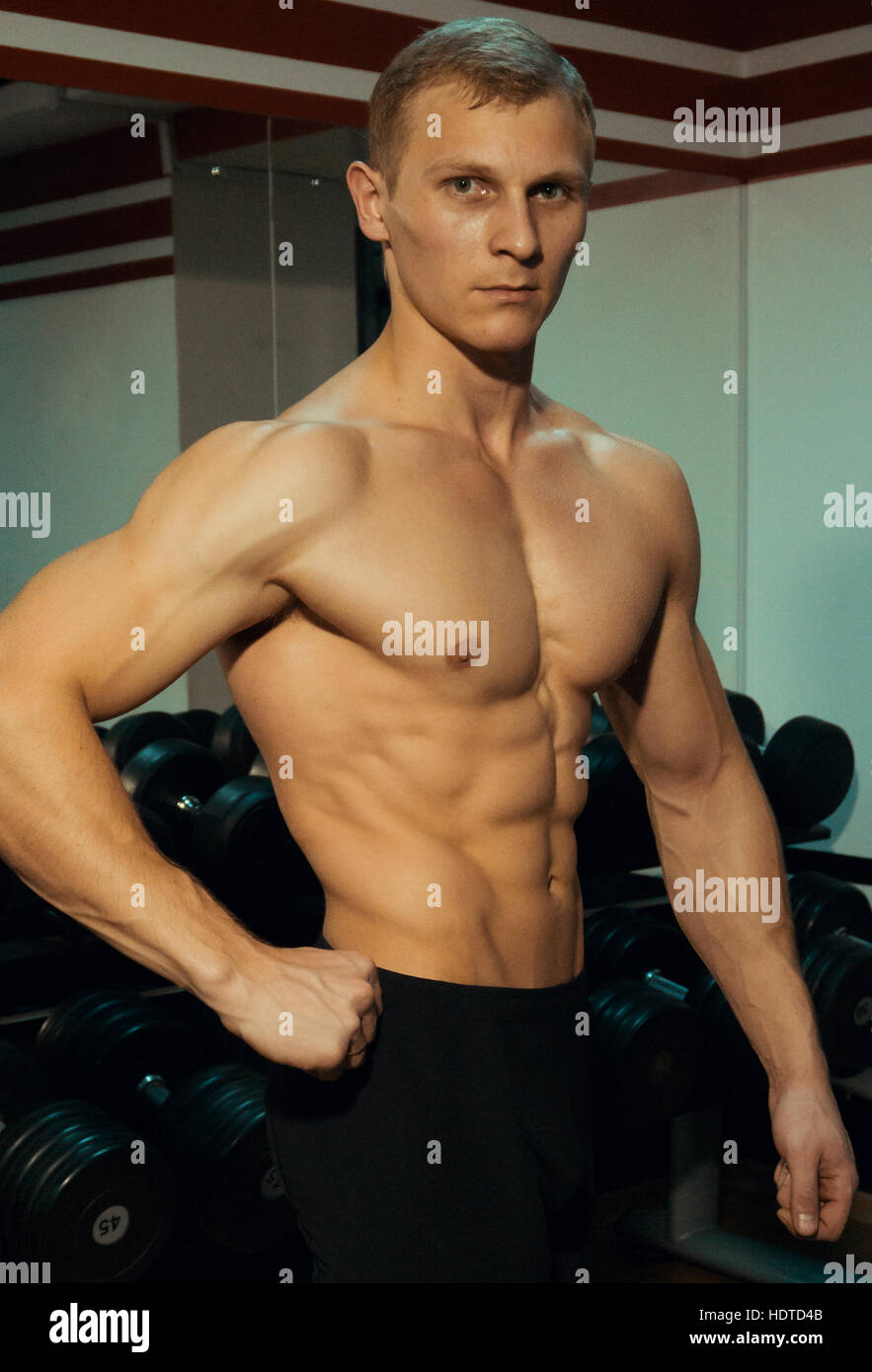 Beautiful bodybuilder posing in the gym Stock Photo - Alamy