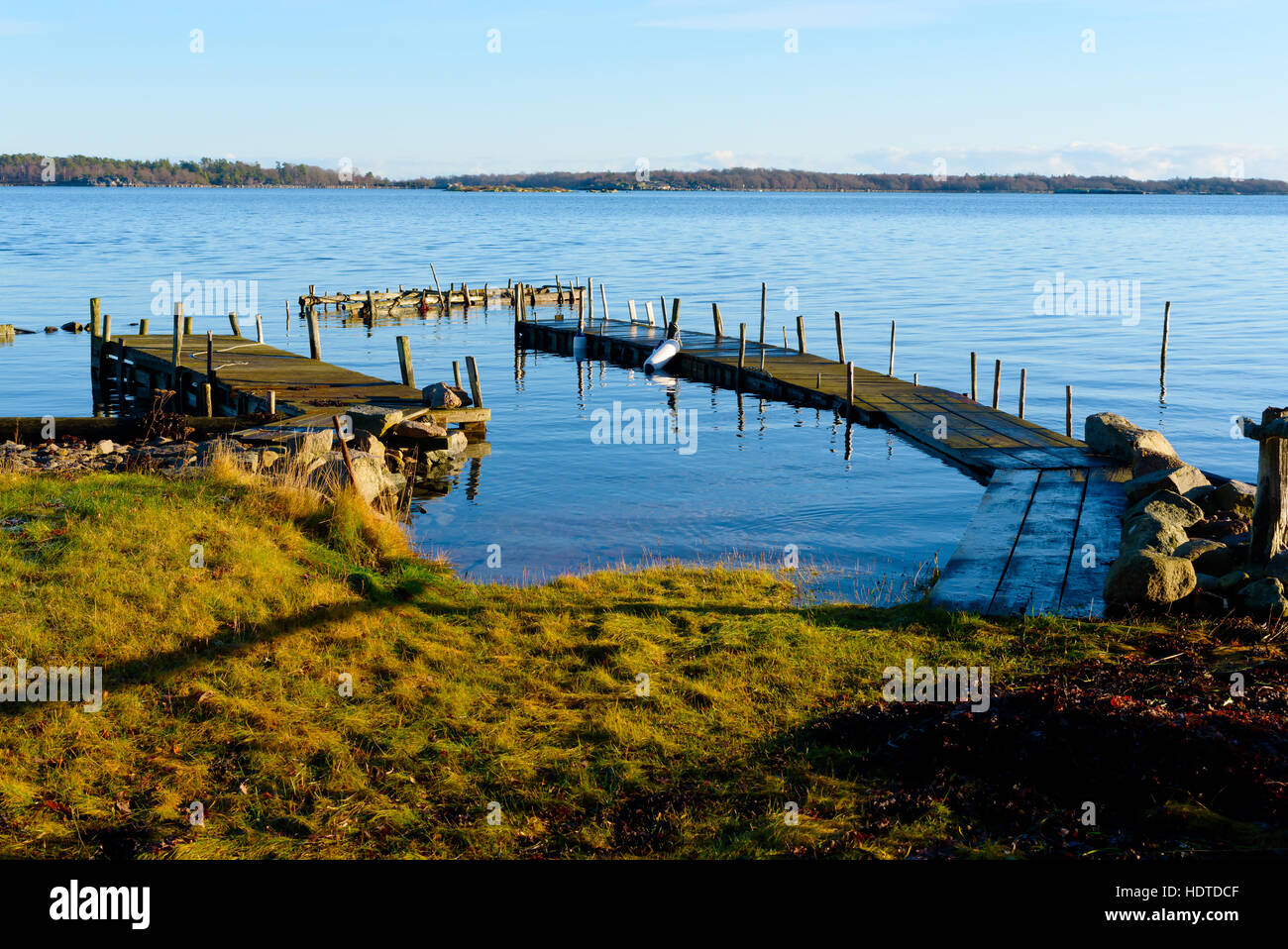 Calm and motionless water surround some piers in the archipelago. The ...