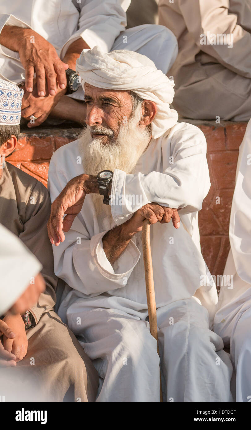 Portrait of an Omani man in traditional Omani clothing attending a ...