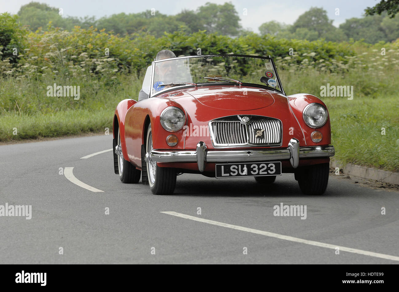Red MGA hood down action shot Stock Photo - Alamy