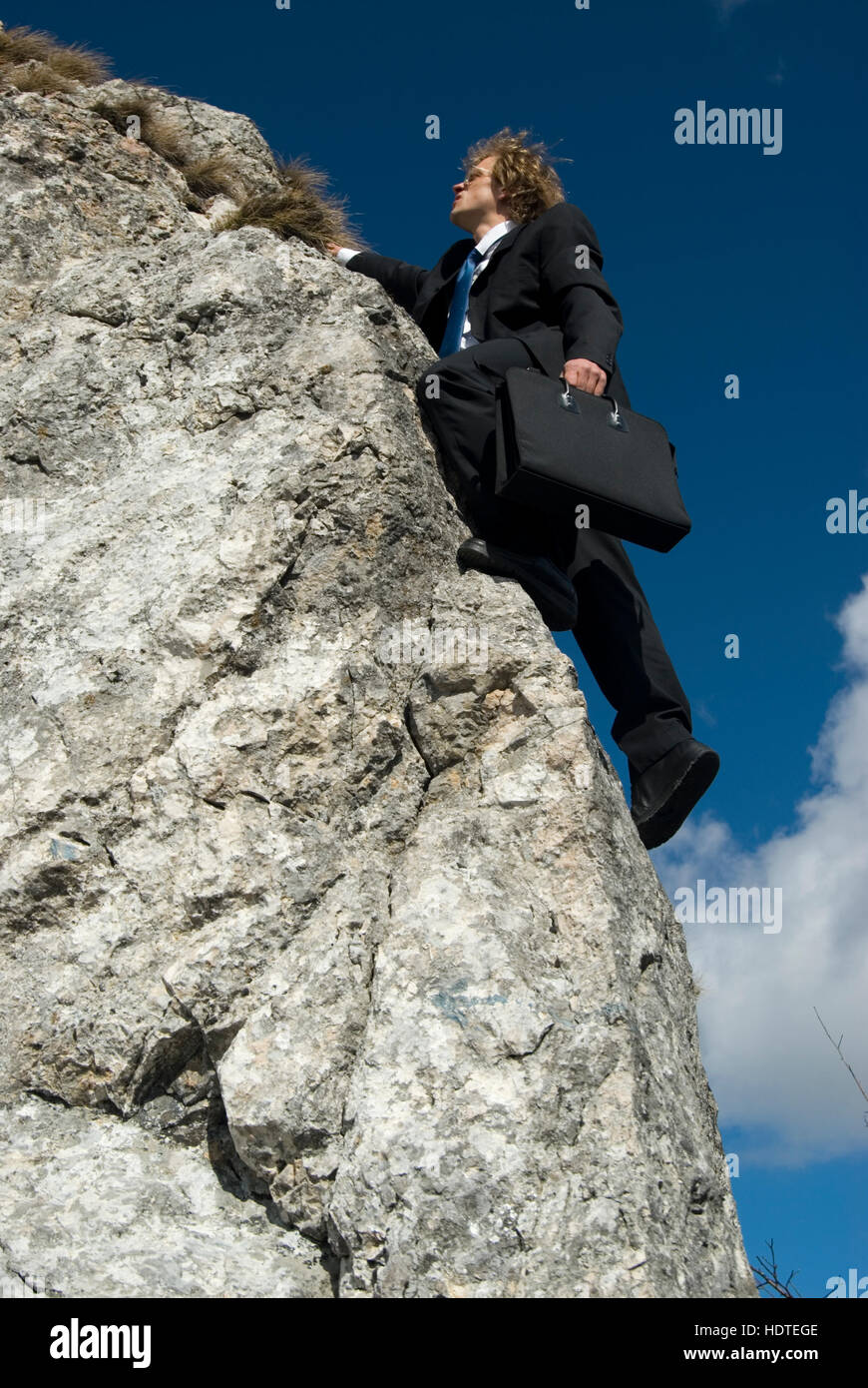 Businessman climbing mountain hi-res stock photography and images - Alamy