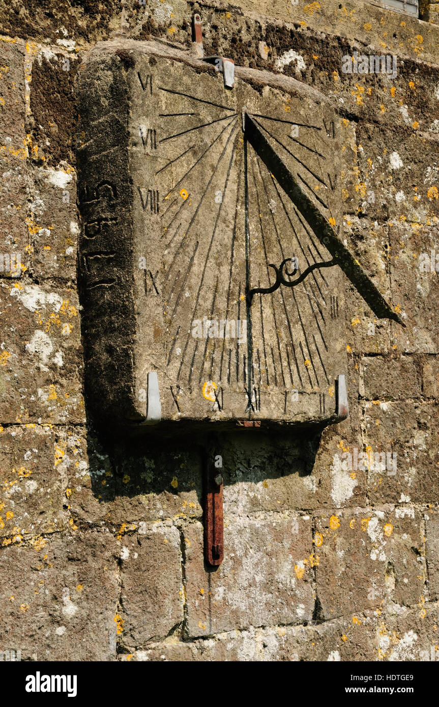 Sundial on the wall of St Mary's church, Kilmington Stock Photo - Alamy